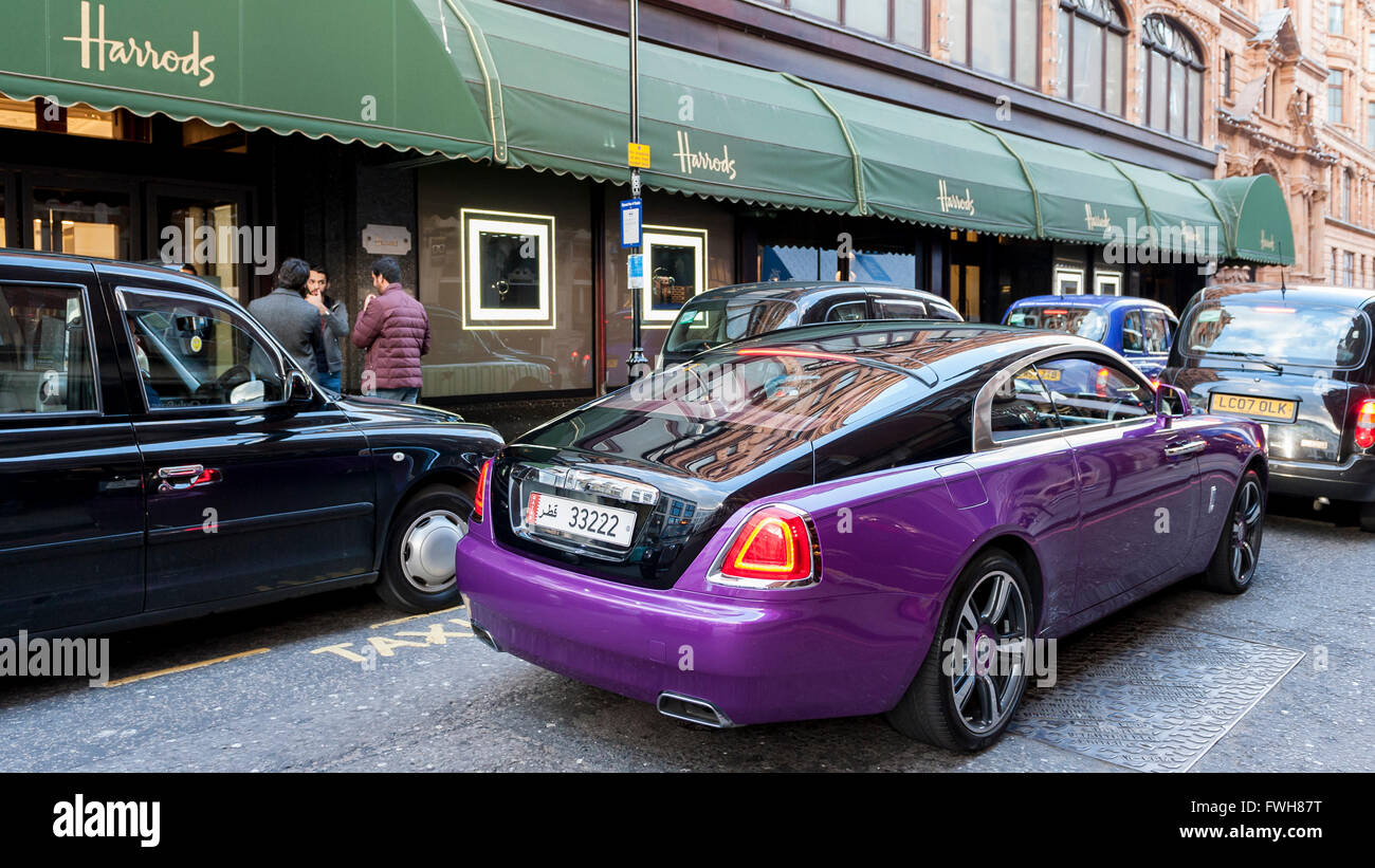 London, UK. 5 April 2016. A Rolls Royce Wraith passes Harrods ...