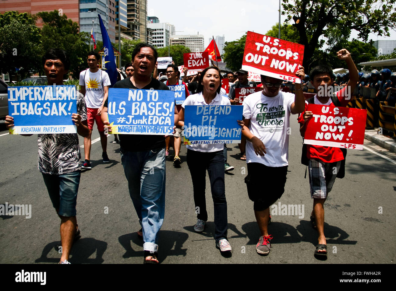 Manila, Philippines. 12th June, 2016. Student protesters march in front ...