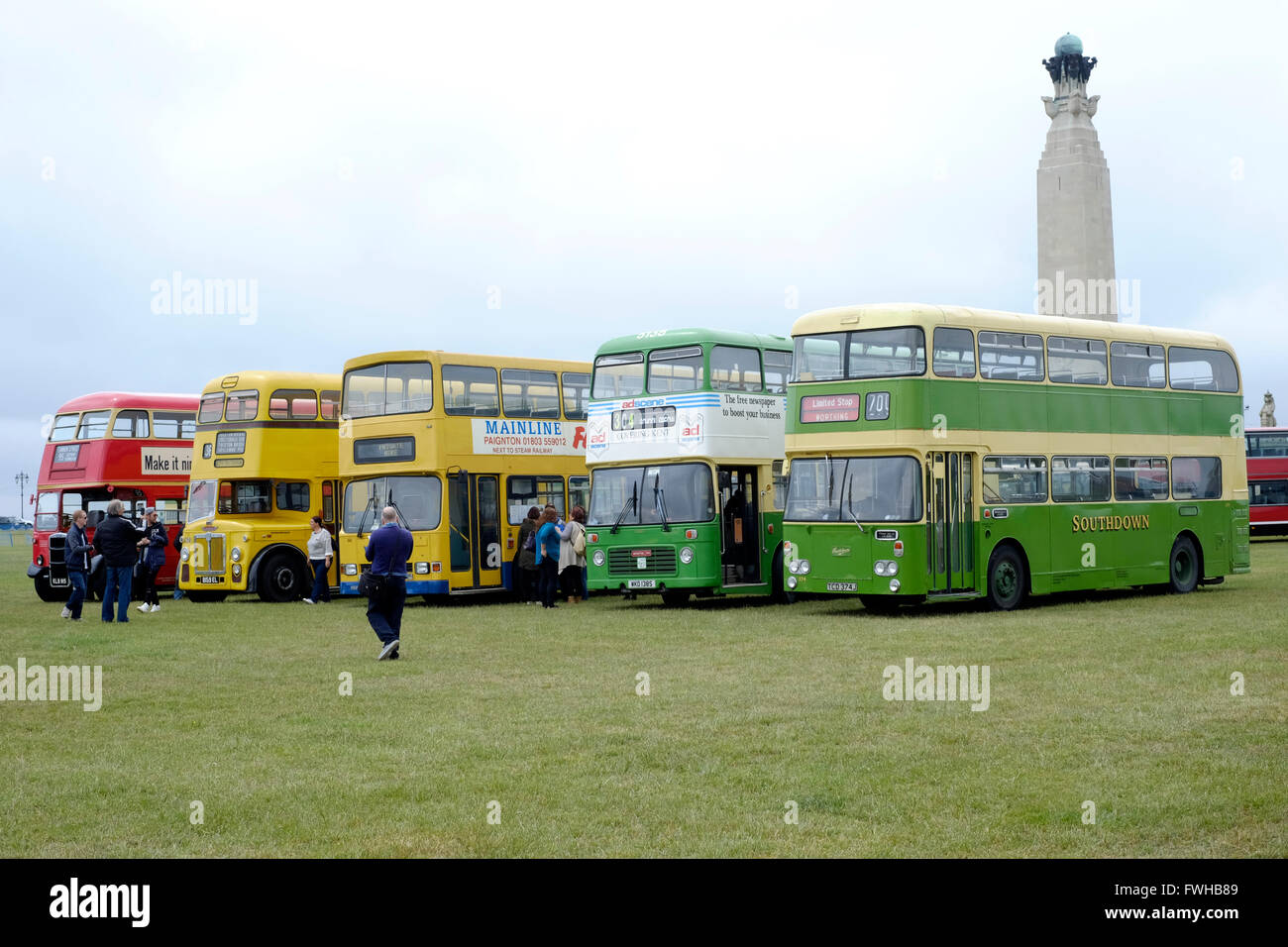 enthusiasts viewing vehicles lined up at a show of classic vintage ...