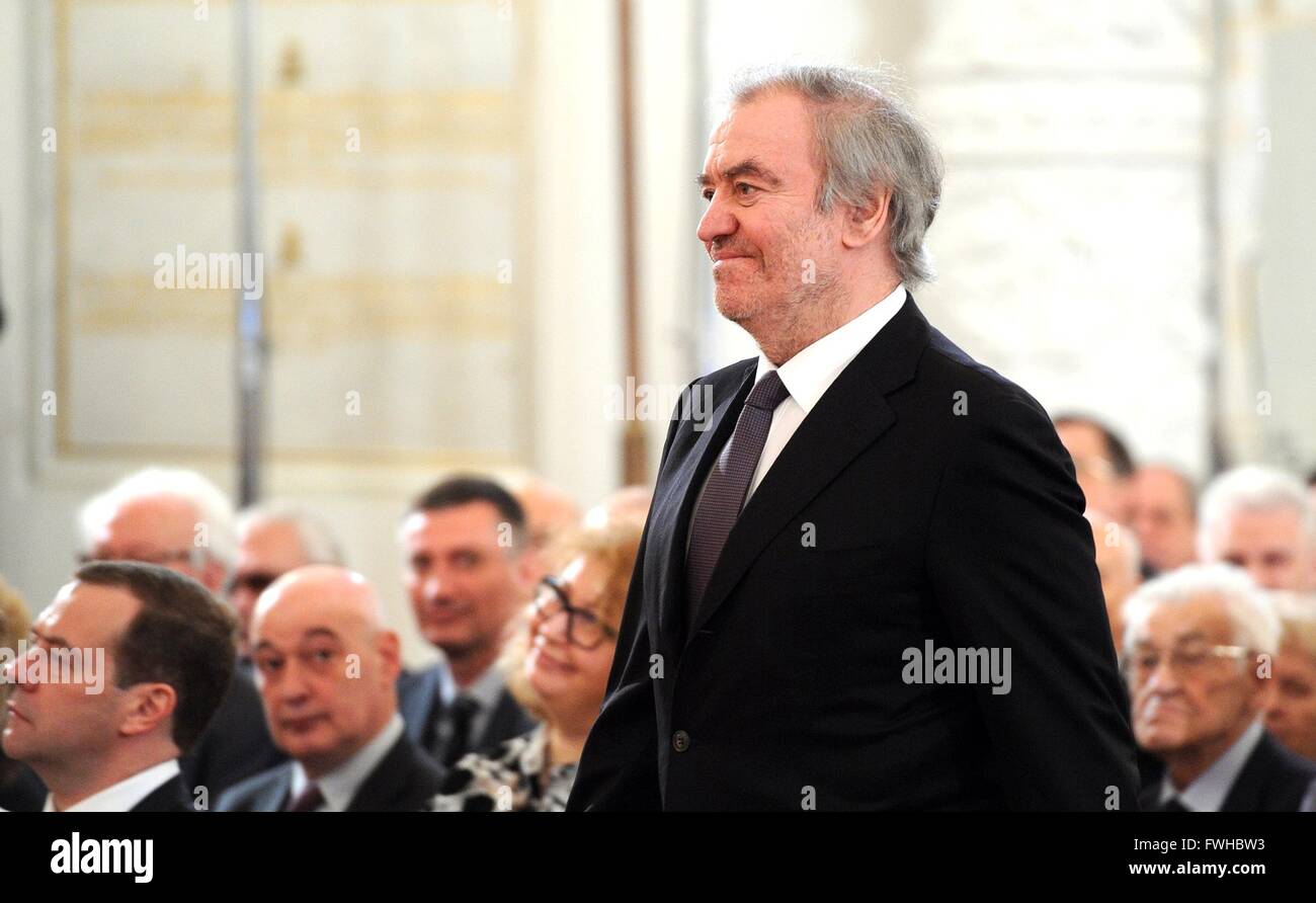 Russian conductor Valery Gergiev stands as President Vladimir Putin ...