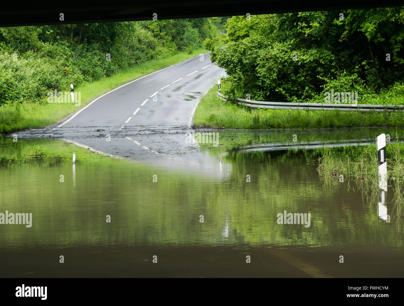 An underpass filled with water and impassable after rainfall that ...