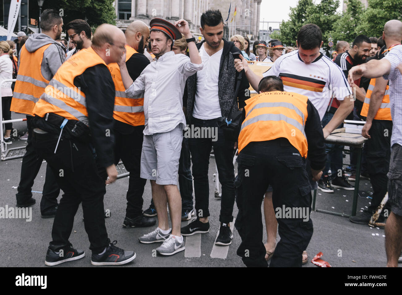 Berlin, Germany. 12th June, 2016. Security staff checking football fans ...