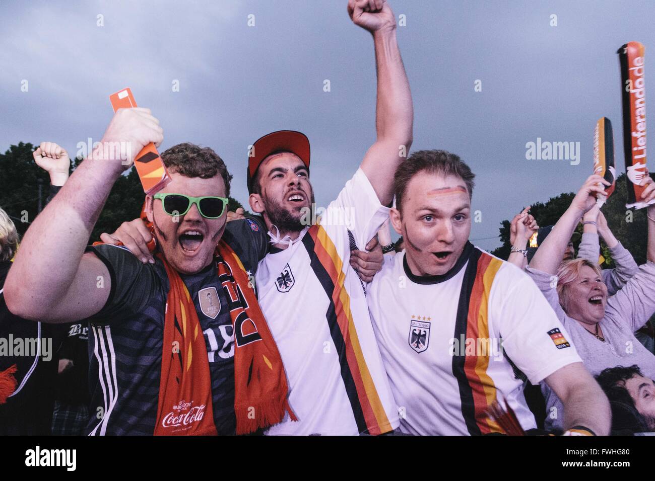Berlin, Germany. 12th June, 2016. German football fans celebrate a goal ...