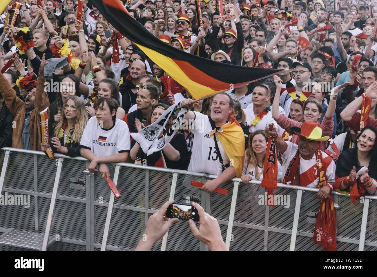Berlin, Germany. 12th June, 2016. German football fans cheer as they ...