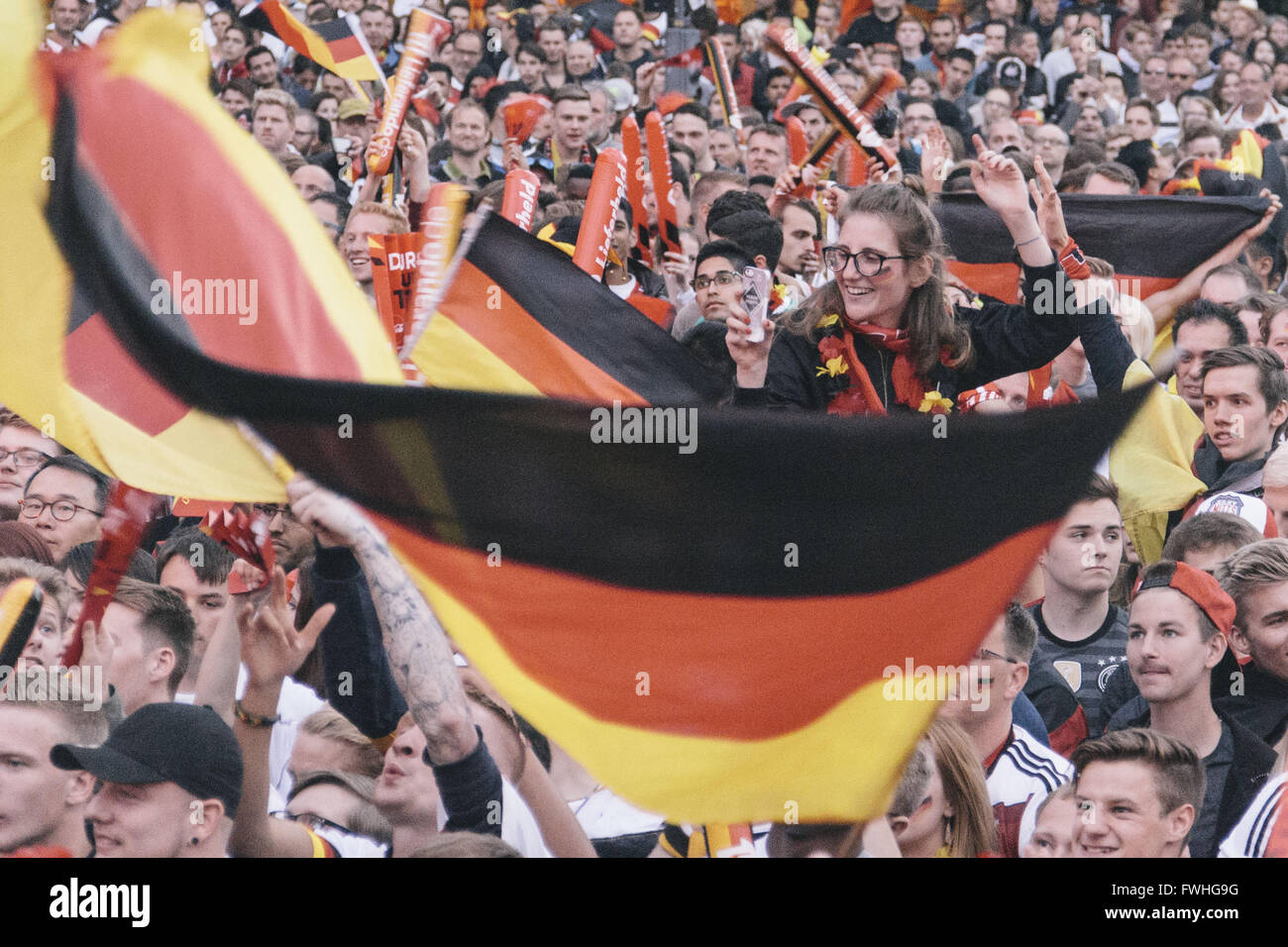 Berlin, Germany. 12th June, 2016. German football fans cheer as they ...