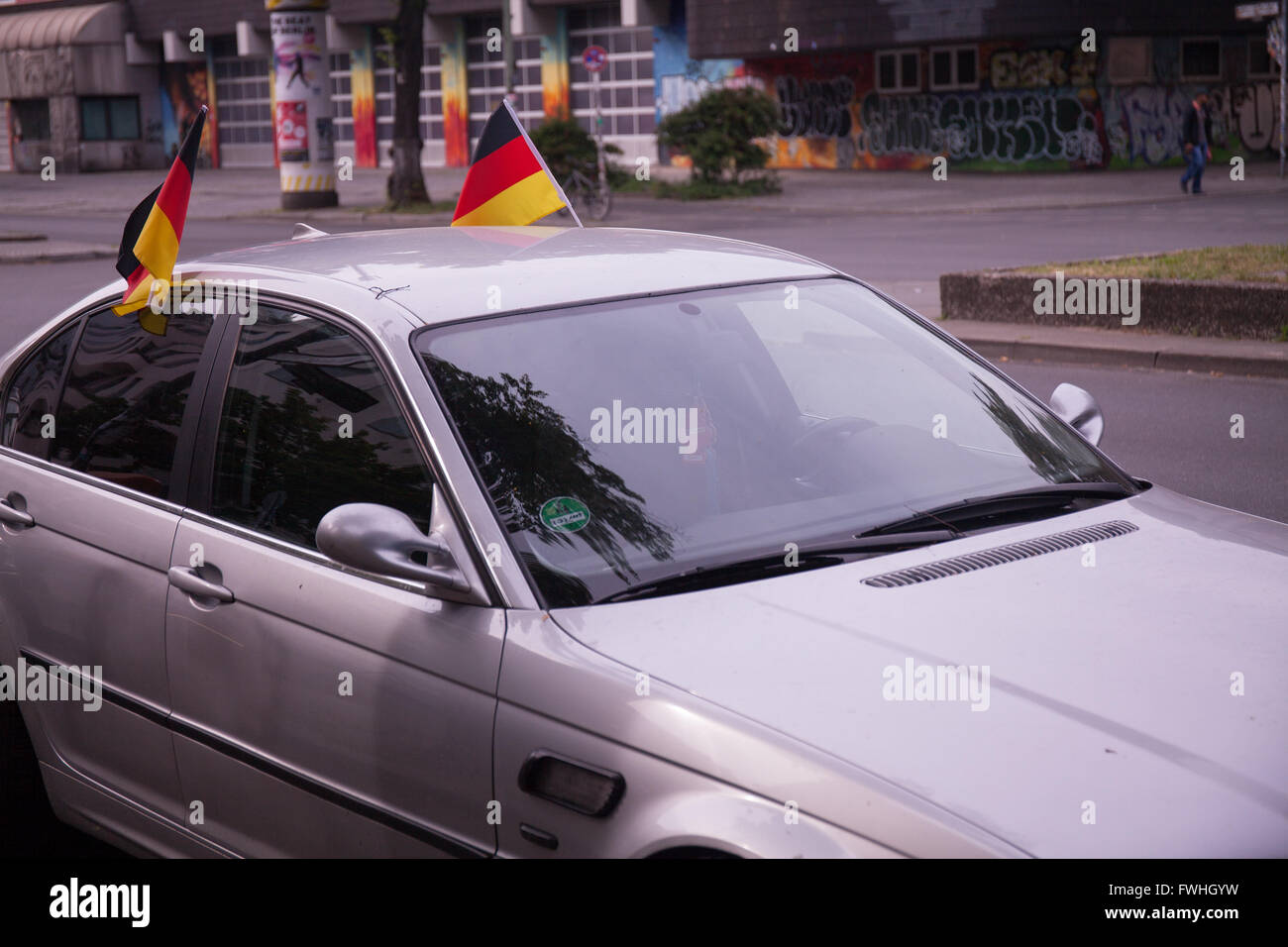 German flags in a car during the UEFA games. Berlin, Wiener Street ...