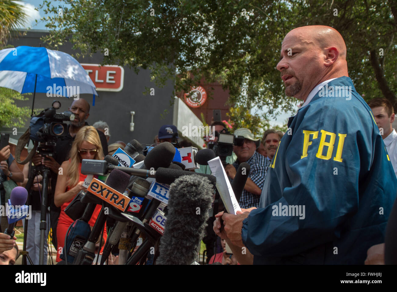 Orlando, Florida, USA. 12th June, 2016. FBI Agent Ron Hopper announces ...