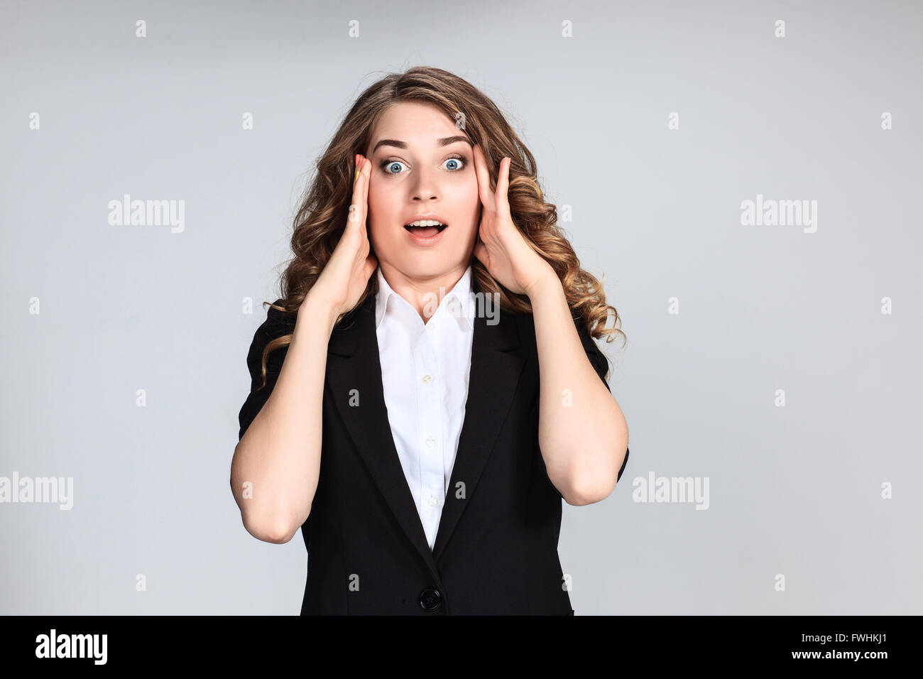 Portrait of young woman with shocked facial expression Stock Photo - Alamy