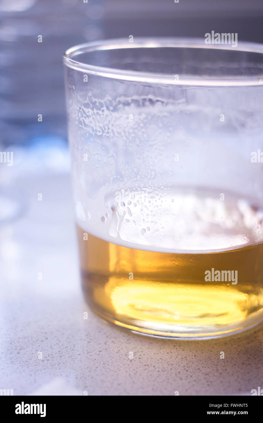 Half empty lager beer glass in restaurant bar photo Stock Photo - Alamy