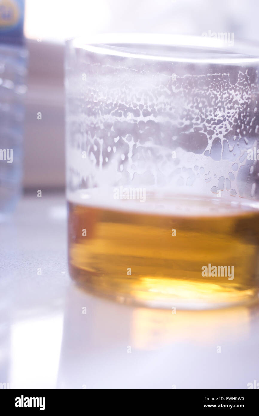 Half empty lager beer glass in restaurant bar photo Stock Photo - Alamy