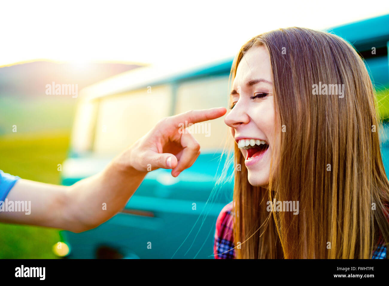 Teenage couple in love outside, man touching her nose Stock Photo - Alamy