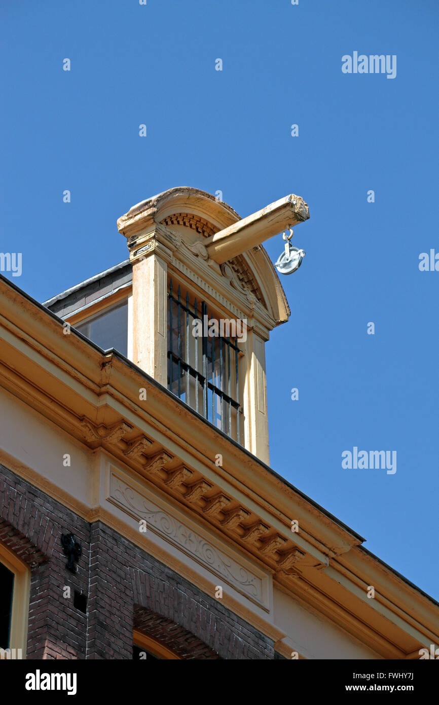 Traditional lifting pulley on the top of a building in Amsterdam ...