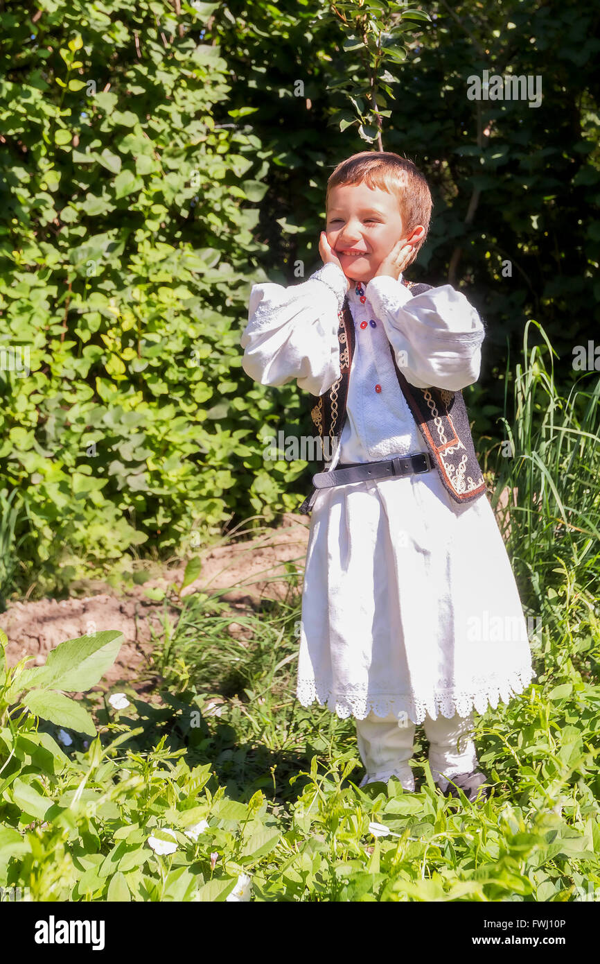 Portrait Of A Happy Child Dressed In Traditional Romanian Folk Costume ...