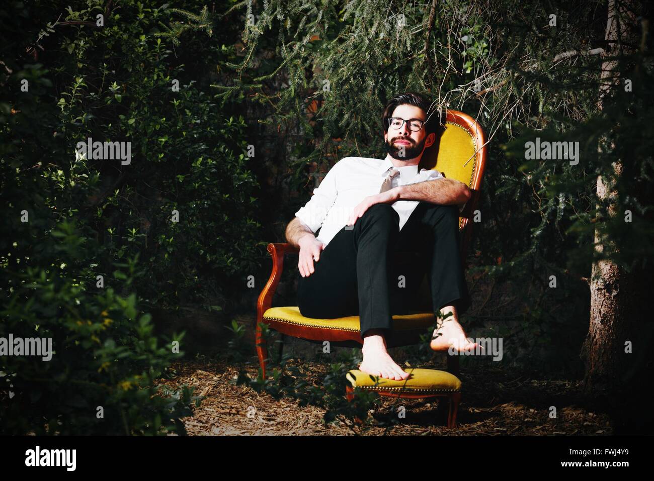 Barefoot sitting hi-res stock photography and images - Alamy