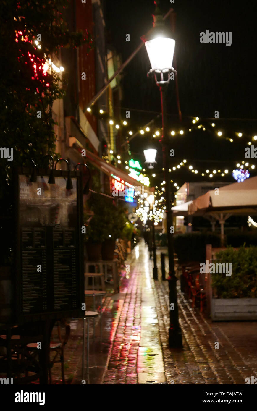 Street Light On Narrow Road Amidst Houses At Night Stock Photo - Alamy