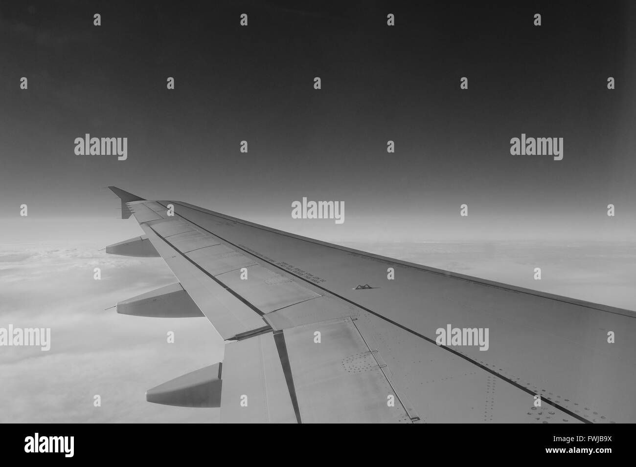 Cropped Image Of Aircraft Wing Over Clouds Against Sky Stock Photo - Alamy