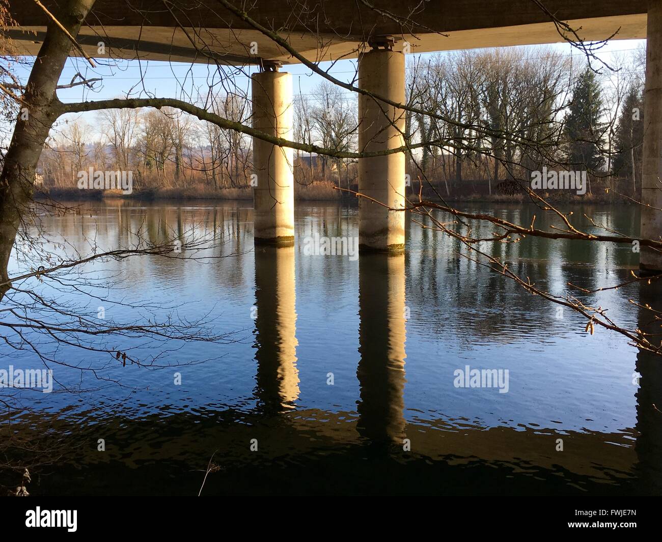 Reflection Of Bridge On River Stock Photo - Alamy