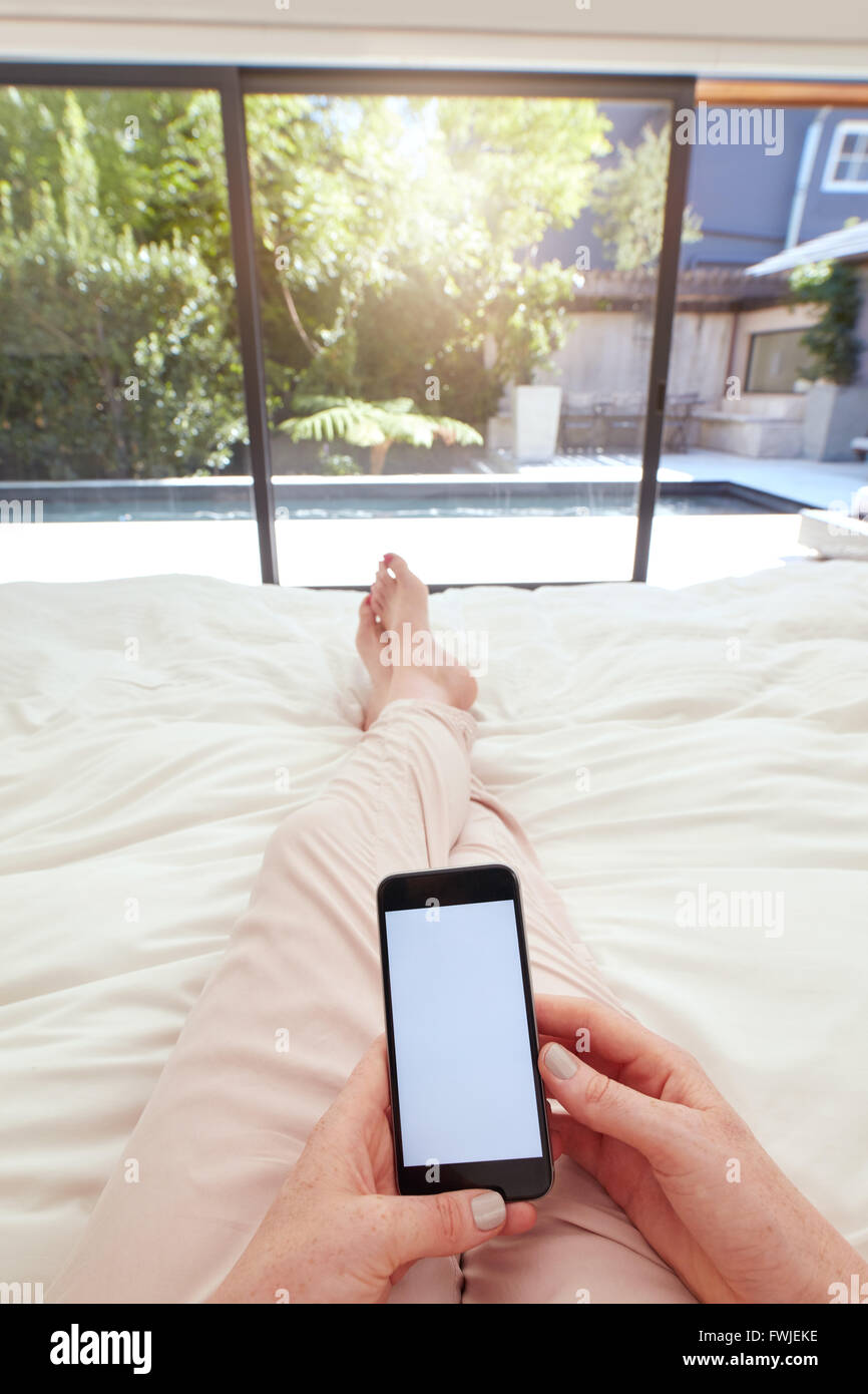 Pov Shot Of A Woman Using Mobile Phone While Lying On Bed Human Hand