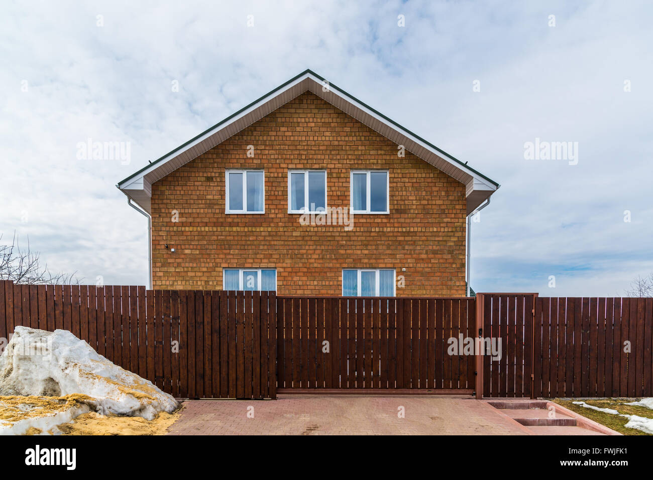two-storey cottage of red brick Stock Photo - Alamy