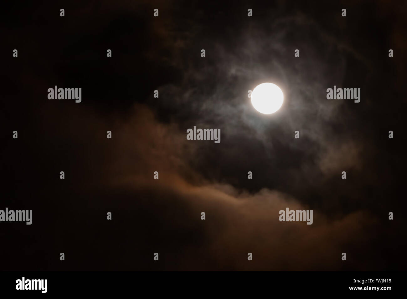 Full Moon Shining Brightly In A Cloudy Sky, Moonlight Stock Photo - Alamy