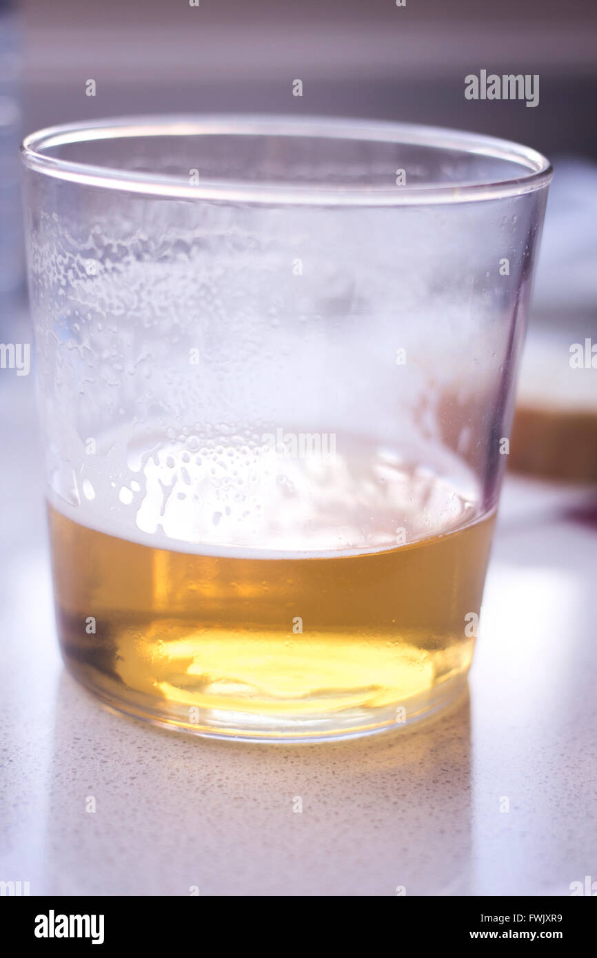 Half empty lager beer glass in restaurant bar photo Stock Photo - Alamy