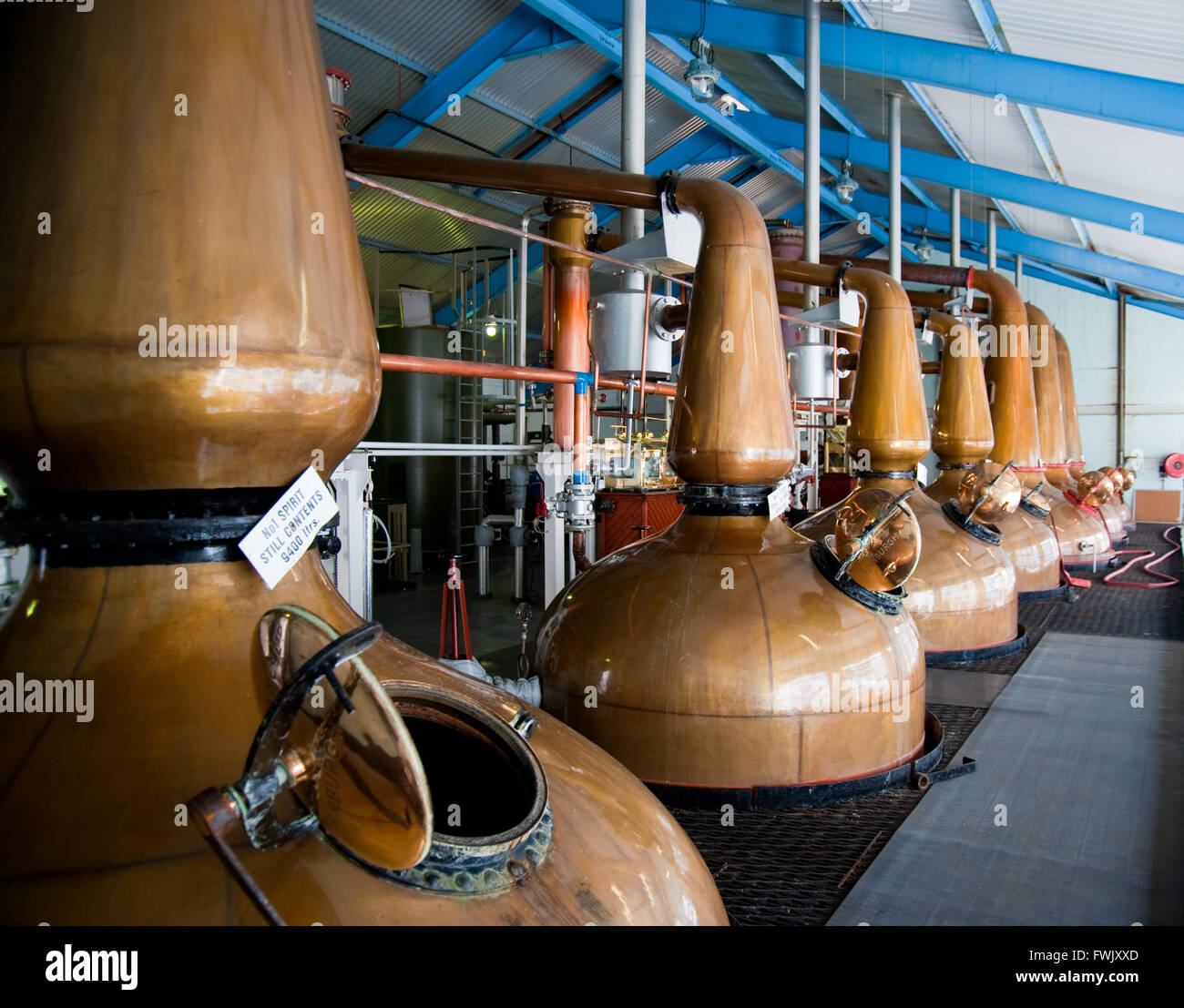 Islay whisky distillery stills Stock Photo - Alamy