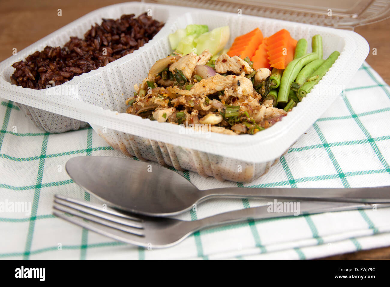 Spicy minced chicken salad and brown rice thai cuisine put in a modern ...