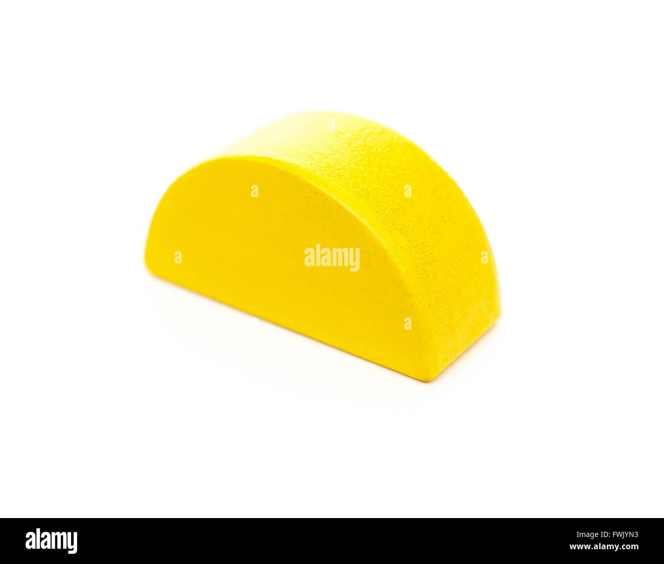 piece of yellow wooden toy block on white background Stock Photo - Alamy