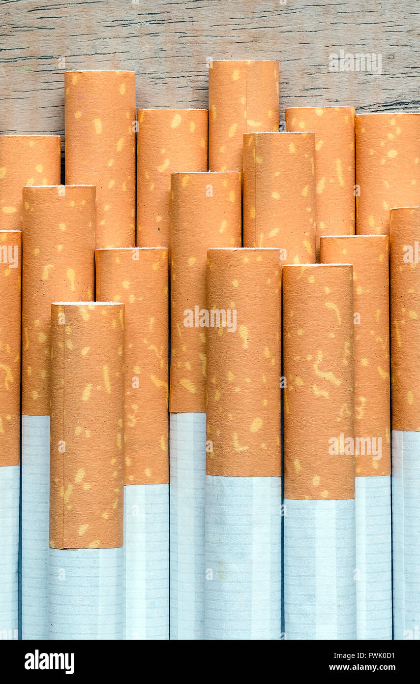 Stack of Tobacco Cigarettes on wooden background Stock Photo - Alamy