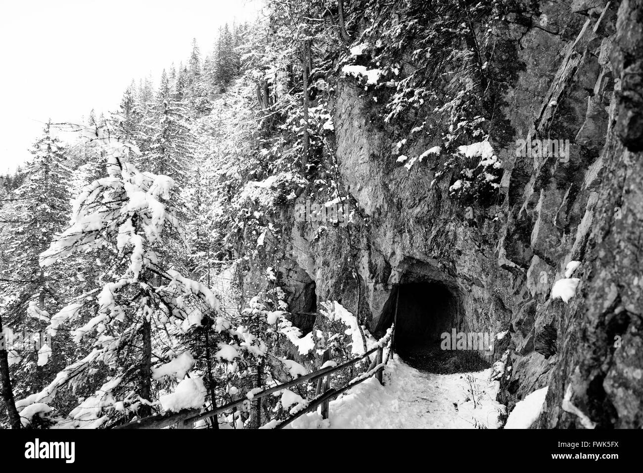 Snow Covered Rock Mountain With Tunnel Stock Photo - Alamy