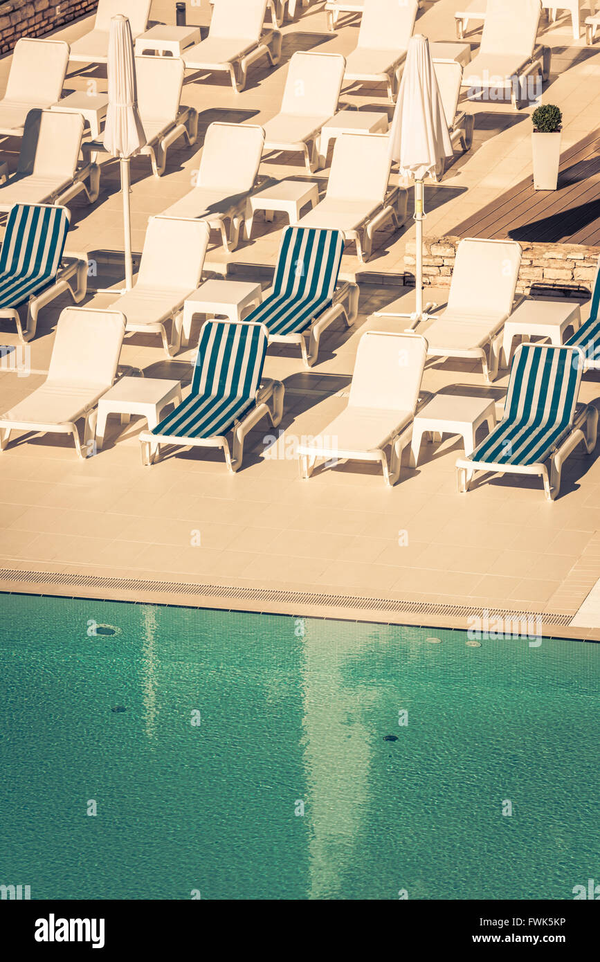 Hotel Poolside Chairs near a swimming pool. Summer shot Stock Photo - Alamy