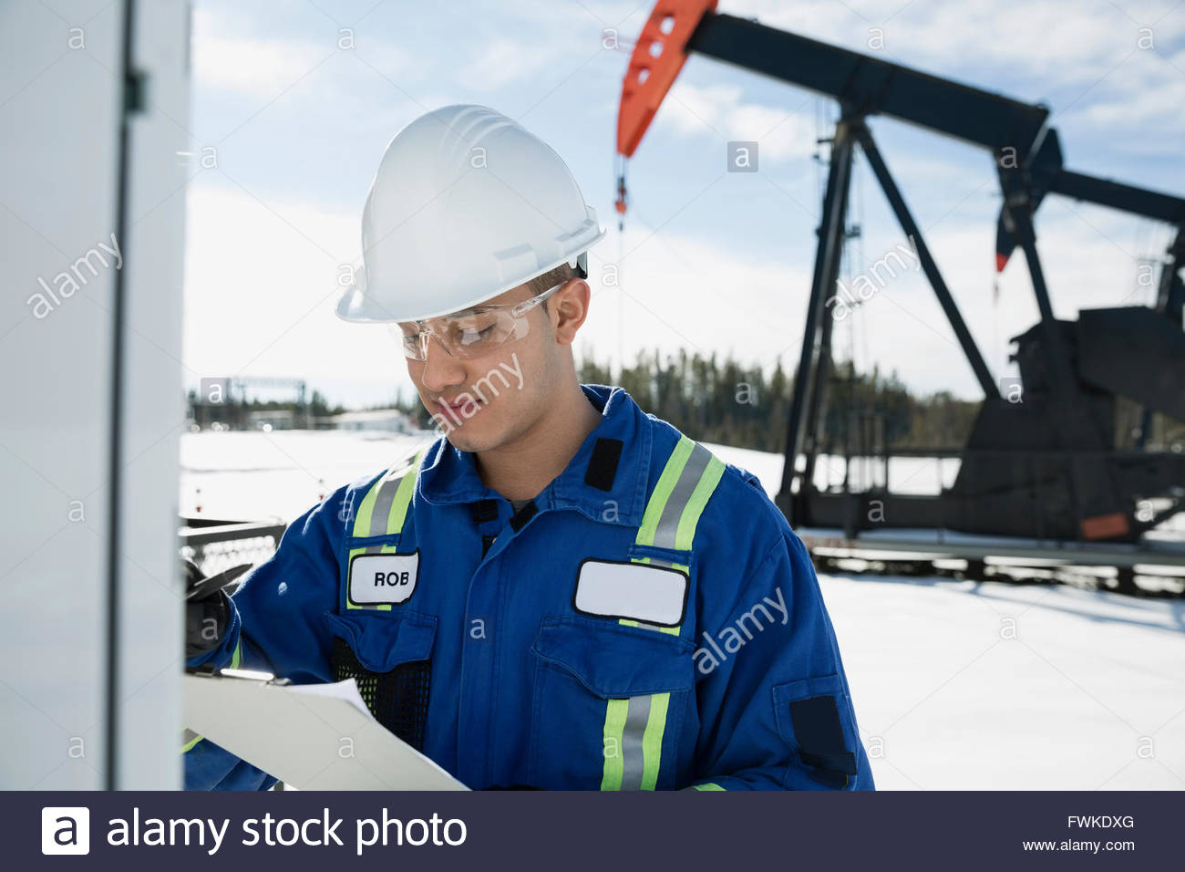 Oil rig worker reading hi-res stock photography and images - Alamy