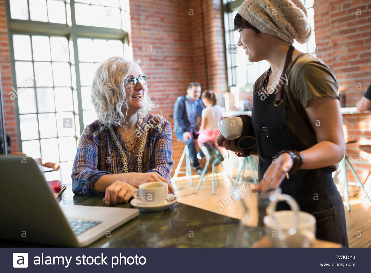 Barista and customer hi-res stock photography and images - Alamy