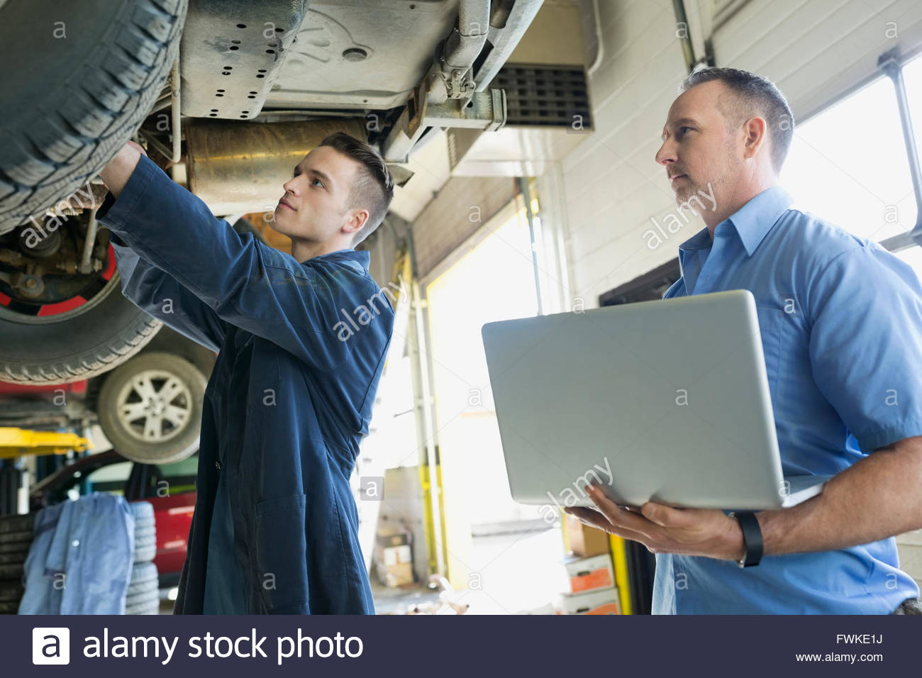 Two men car repair hi-res stock photography and images - Alamy