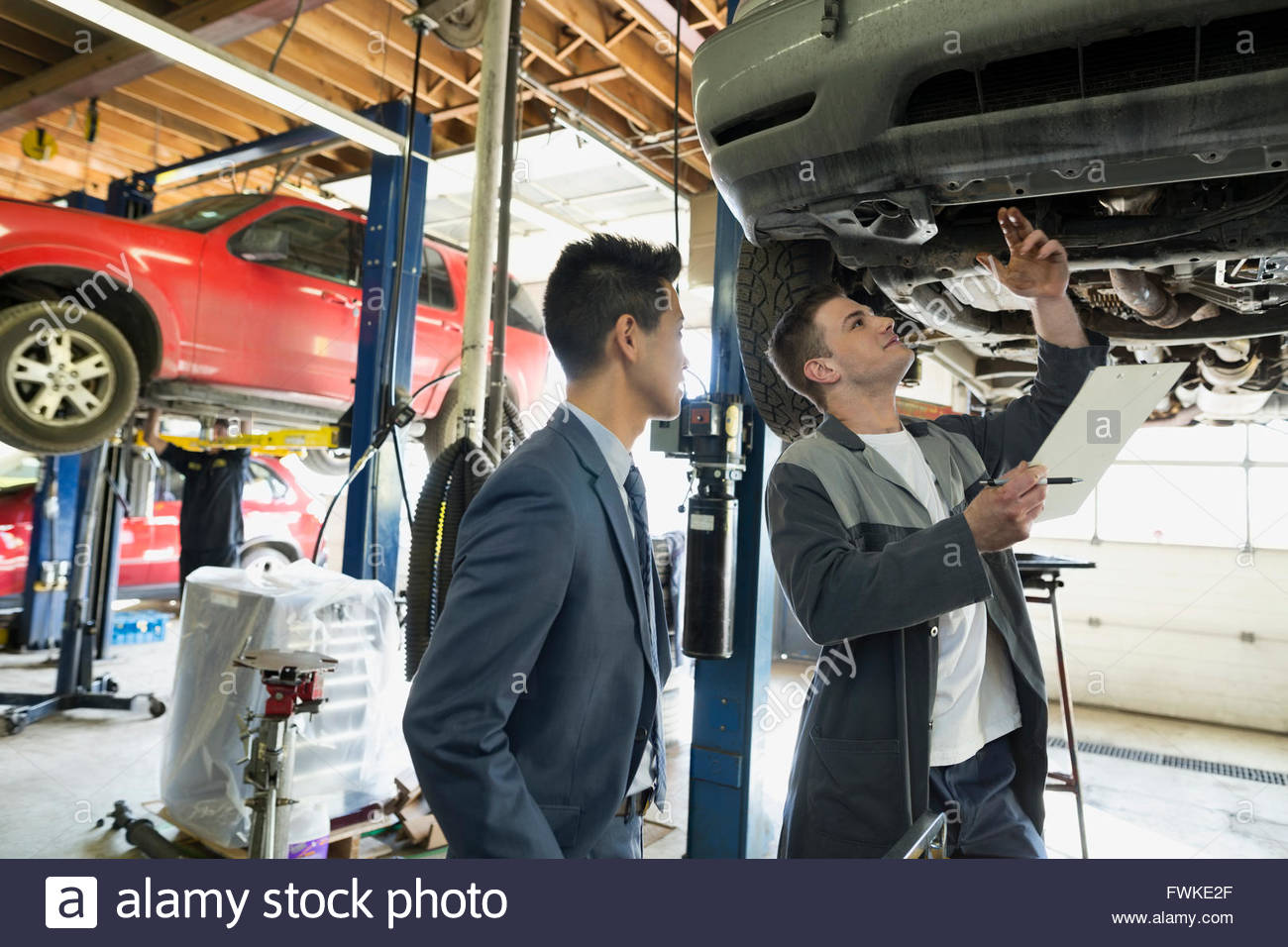 Two men car repair hi-res stock photography and images - Alamy