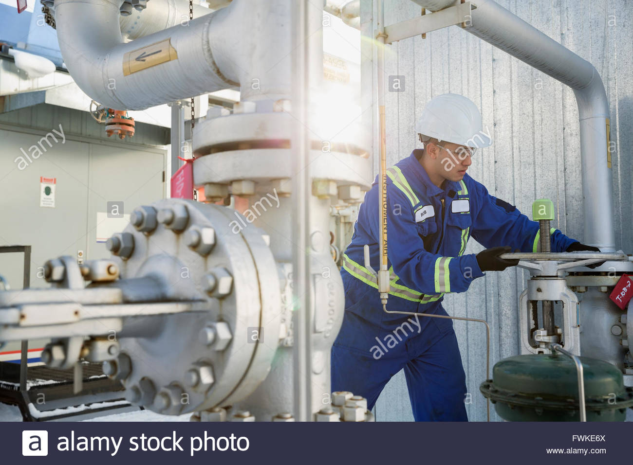 Men opening pipe hi-res stock photography and images - Alamy