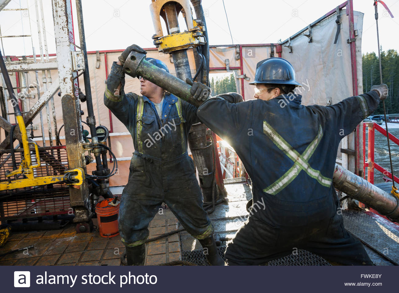 Three Young Oil Rig Workers Stock Photos & Three Young Oil Rig Workers ...