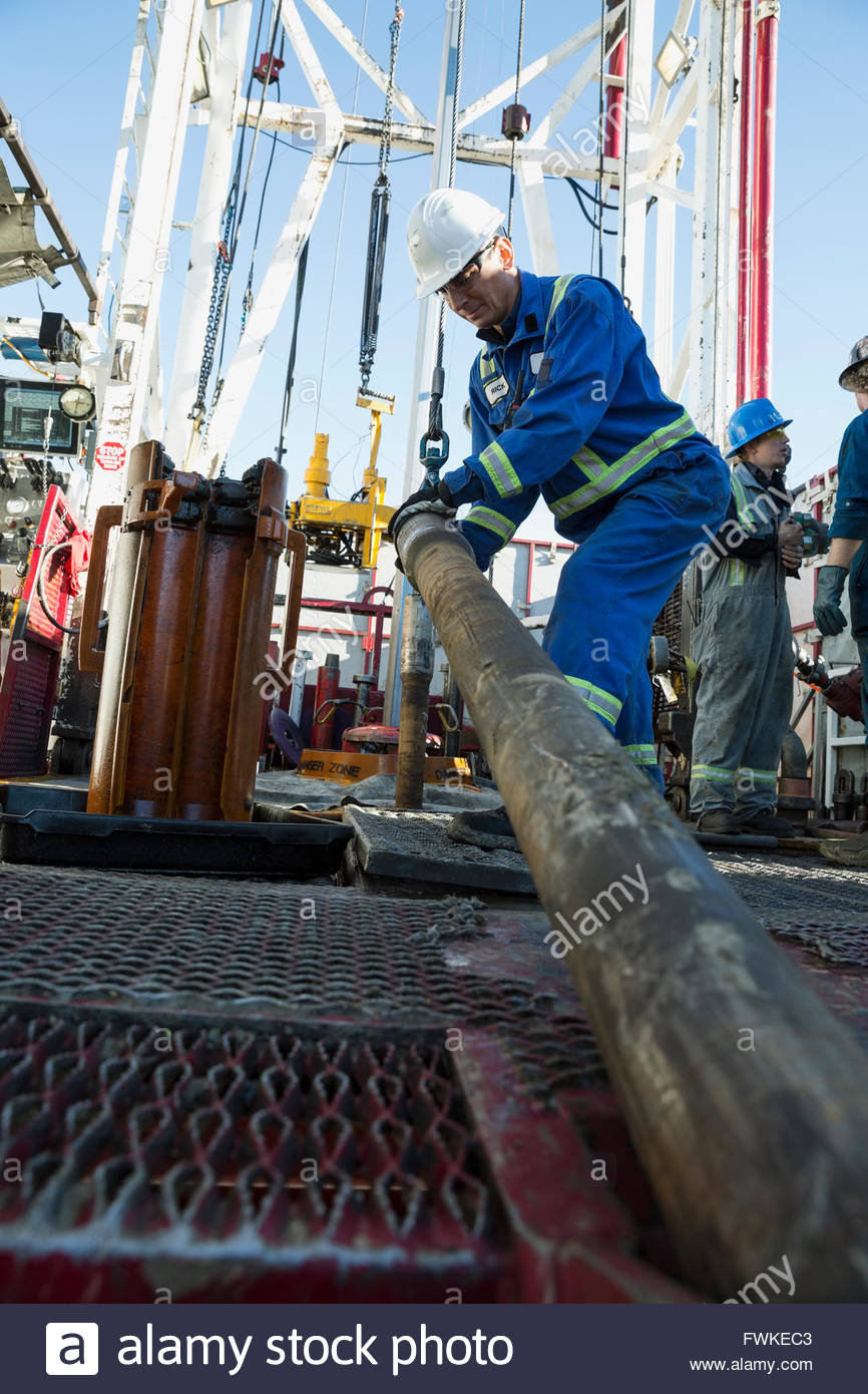 Male worker working drilling rig equipment gas plant Stock Photo - Alamy