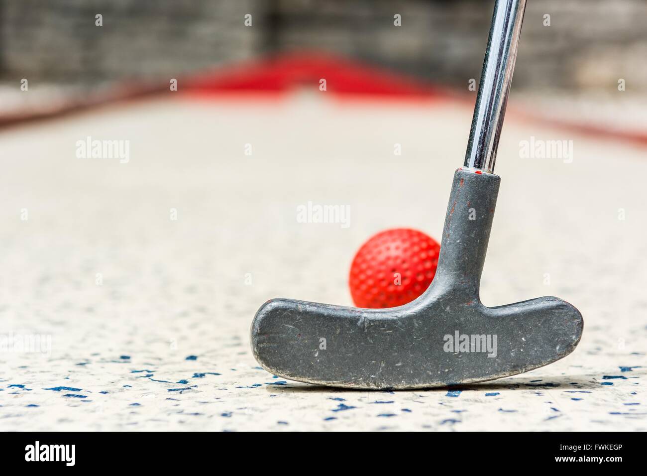 Closeup of red mini golf ball Stock Photo - Alamy