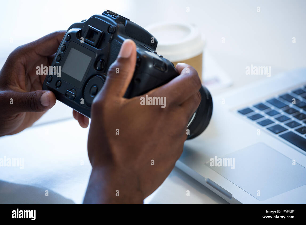 Man checking photo in camera Stock Photo - Alamy