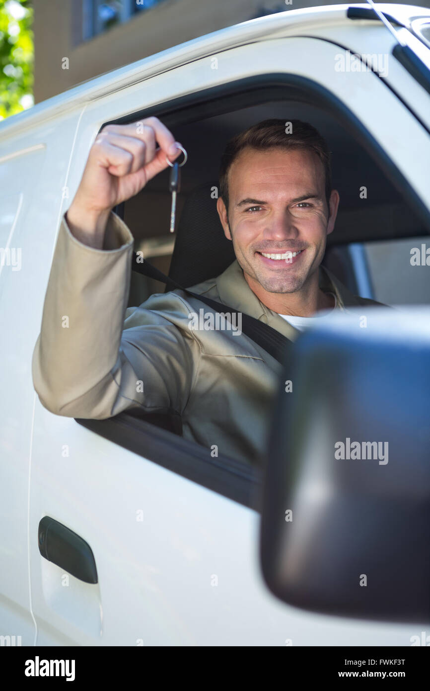 Delivery man sitting in his van Stock Photo - Alamy