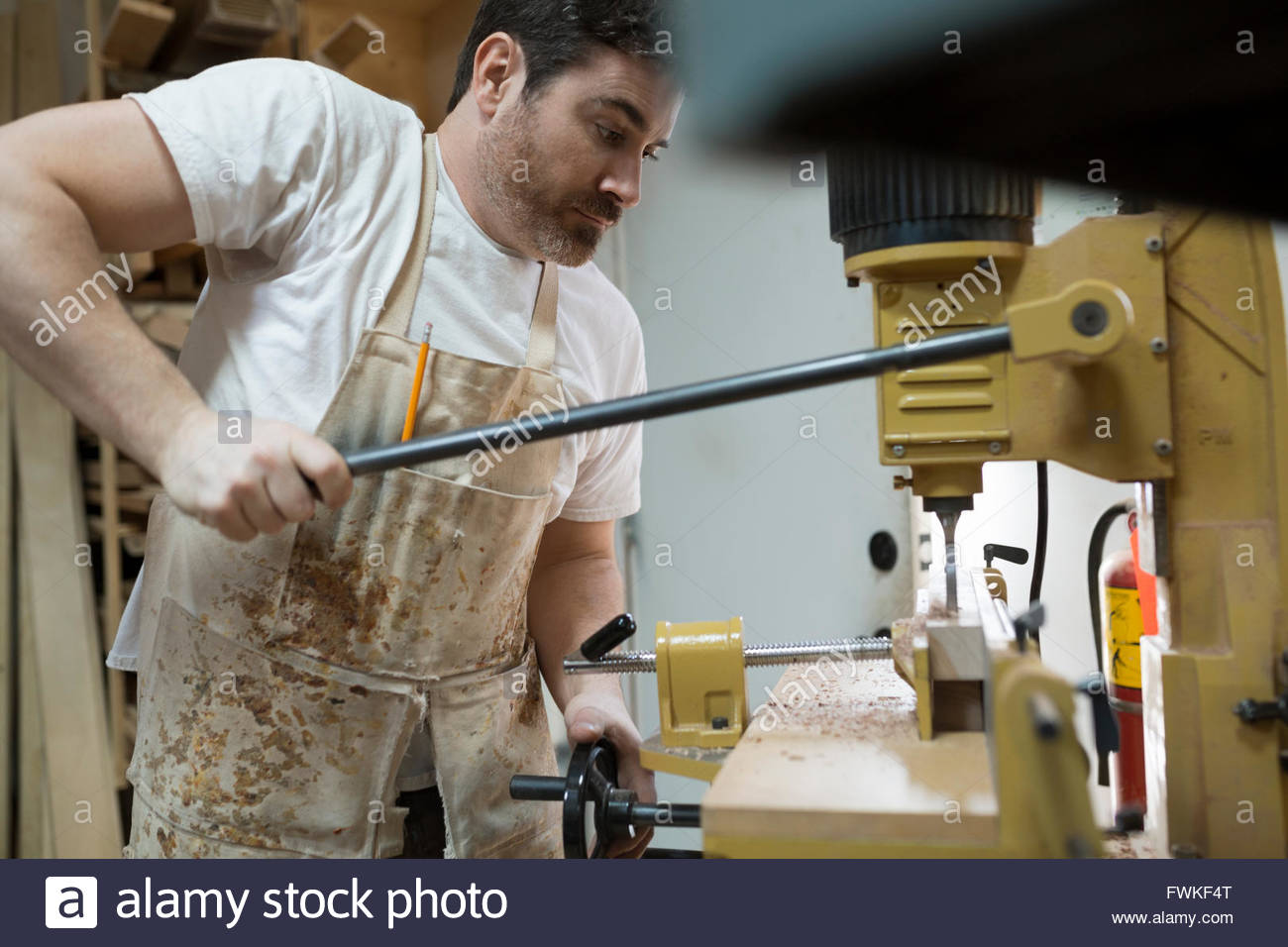 Carpenter using drill press in hi-res stock photography and images - Alamy