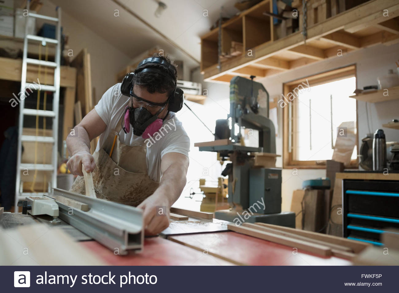 Carpenter wearing protective mask in workshop Stock Photo - Alamy