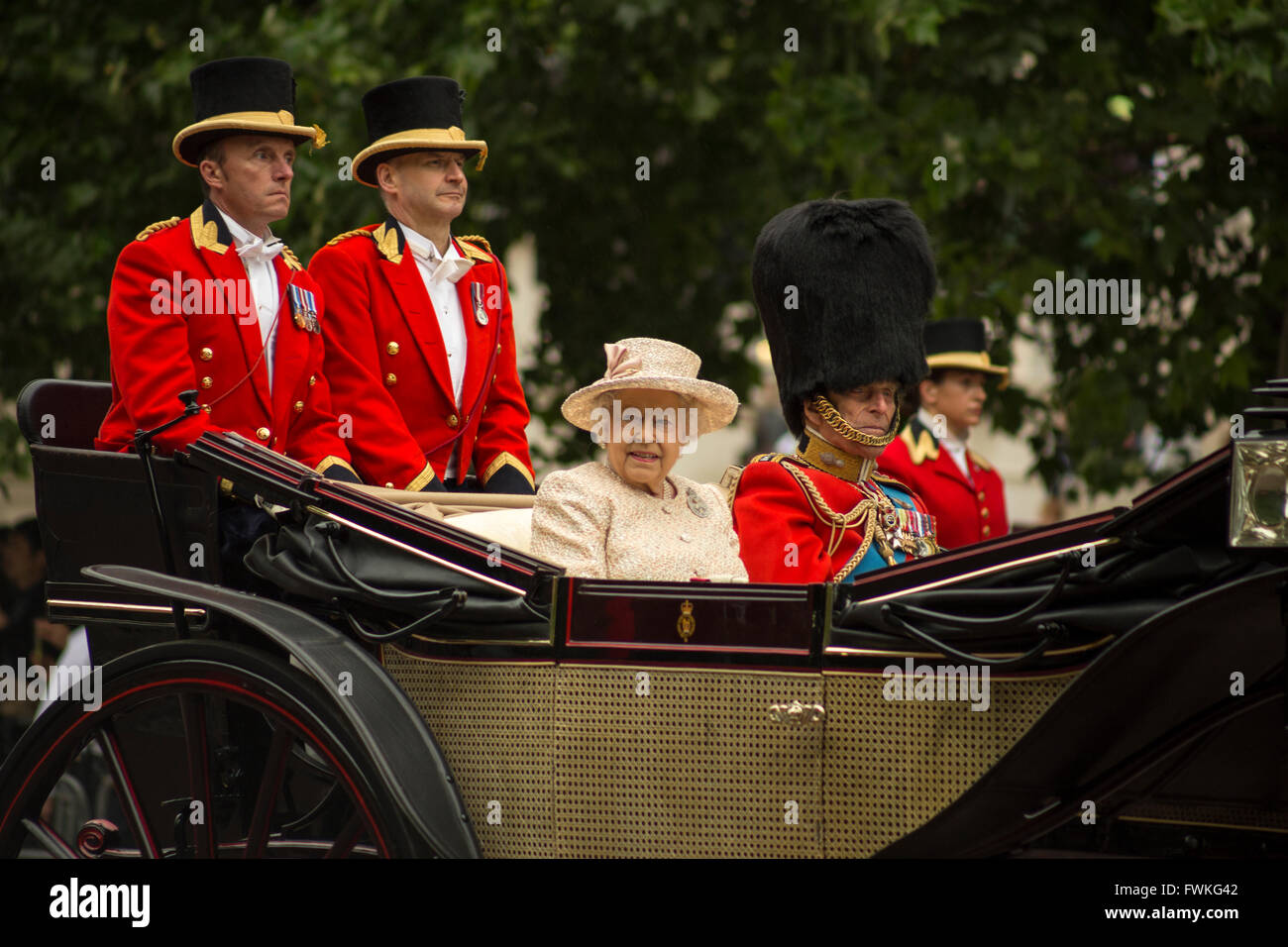 Queen Elizabeth II in an open carriage 2 Stock Photo - Alamy