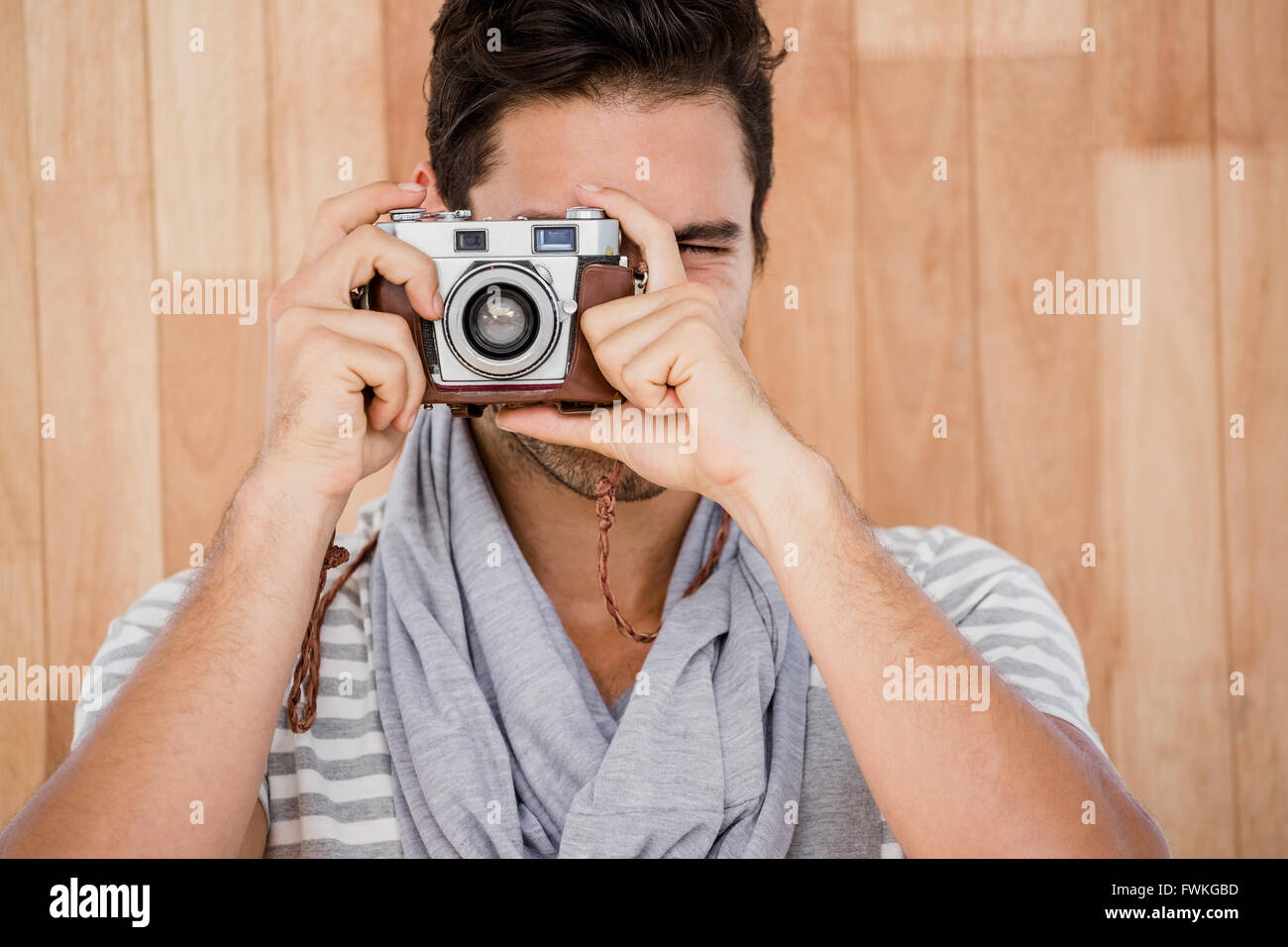 Handsome man taking a photograph Stock Photo - Alamy
