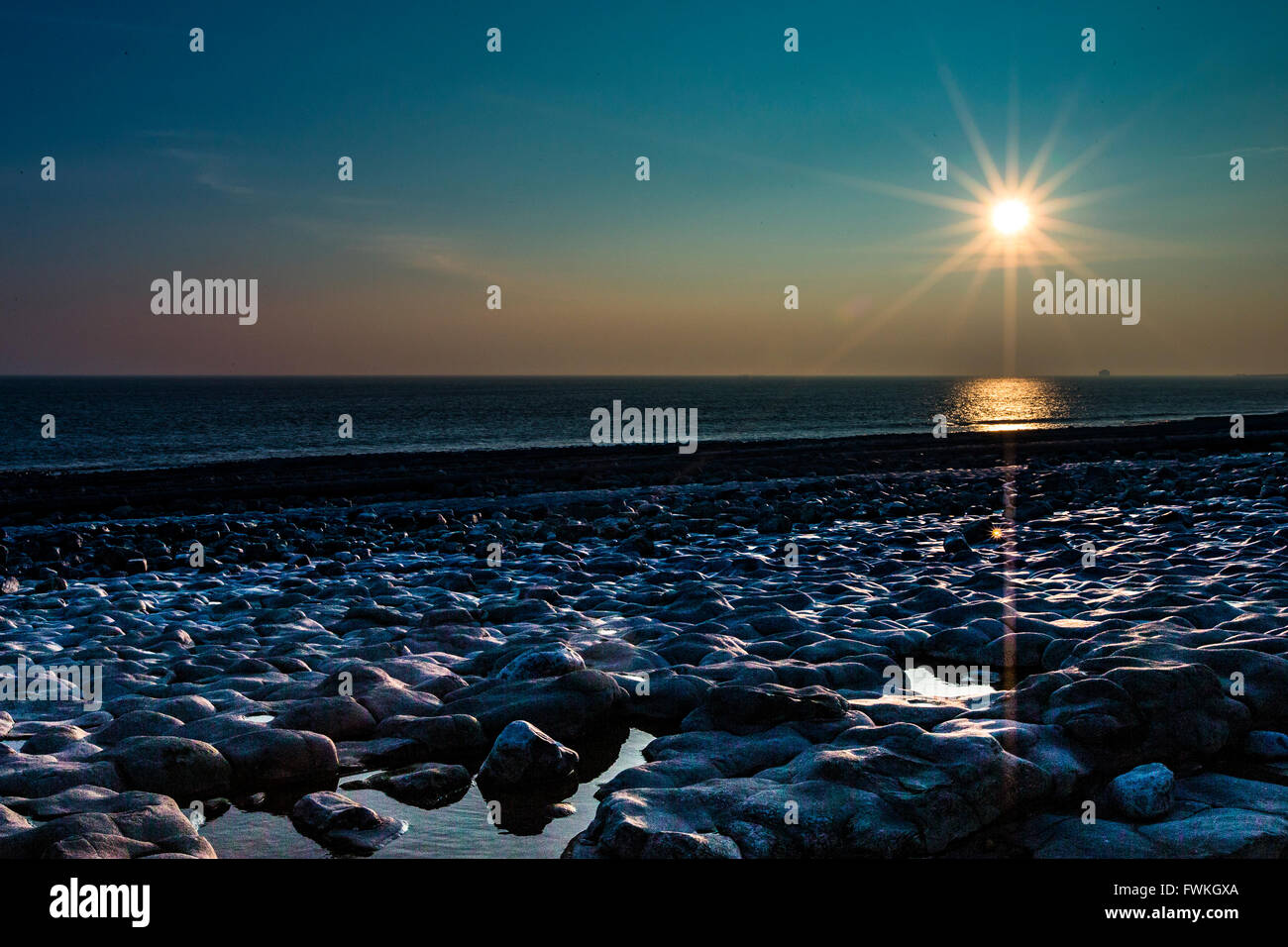 A Sunset, at Rhoose Point, Wales, Rocky Beach Stock Photo - Alamy