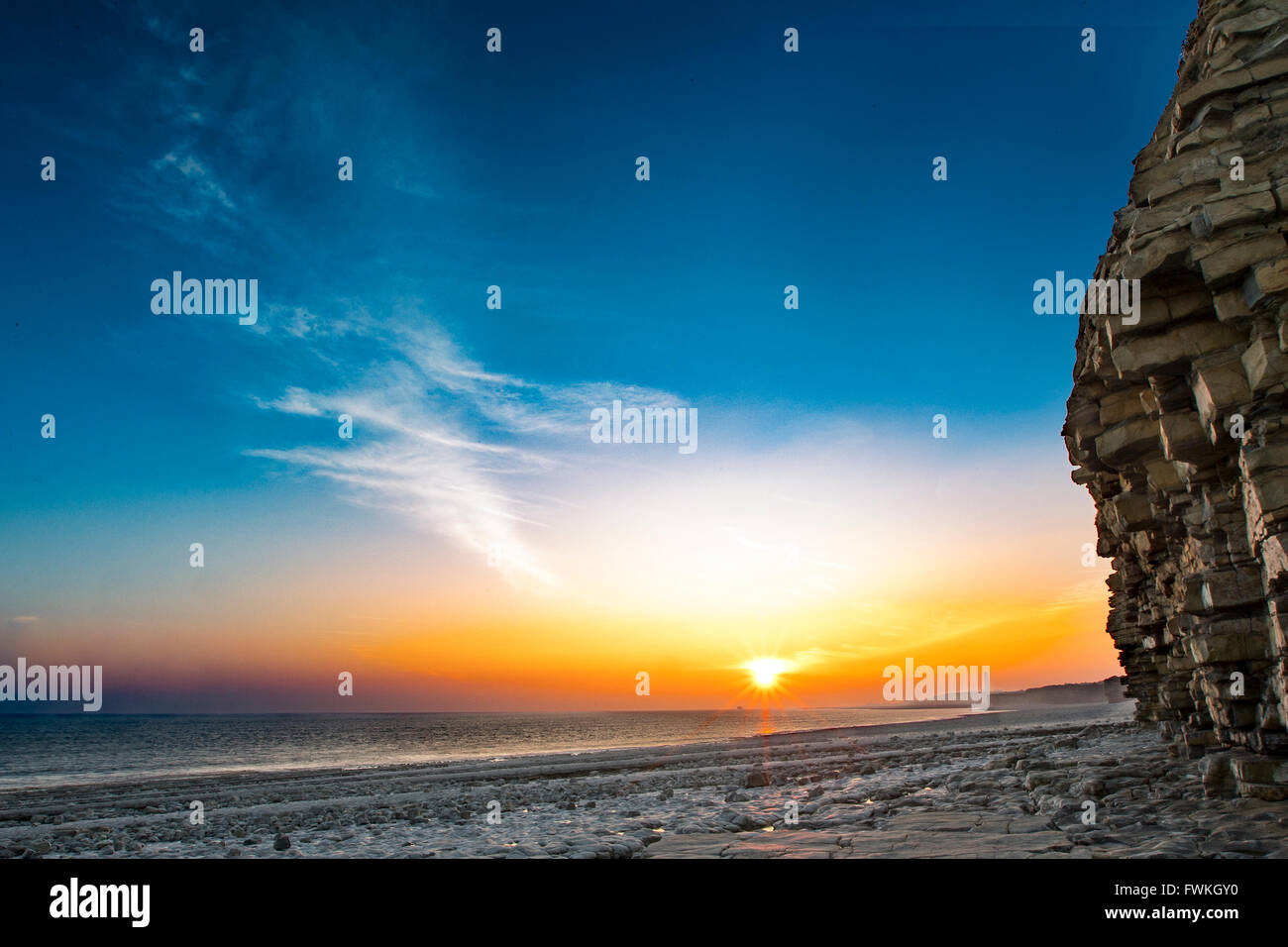 A Sunset, at Rhoose Point, Wales, Rocky Beach Stock Photo - Alamy