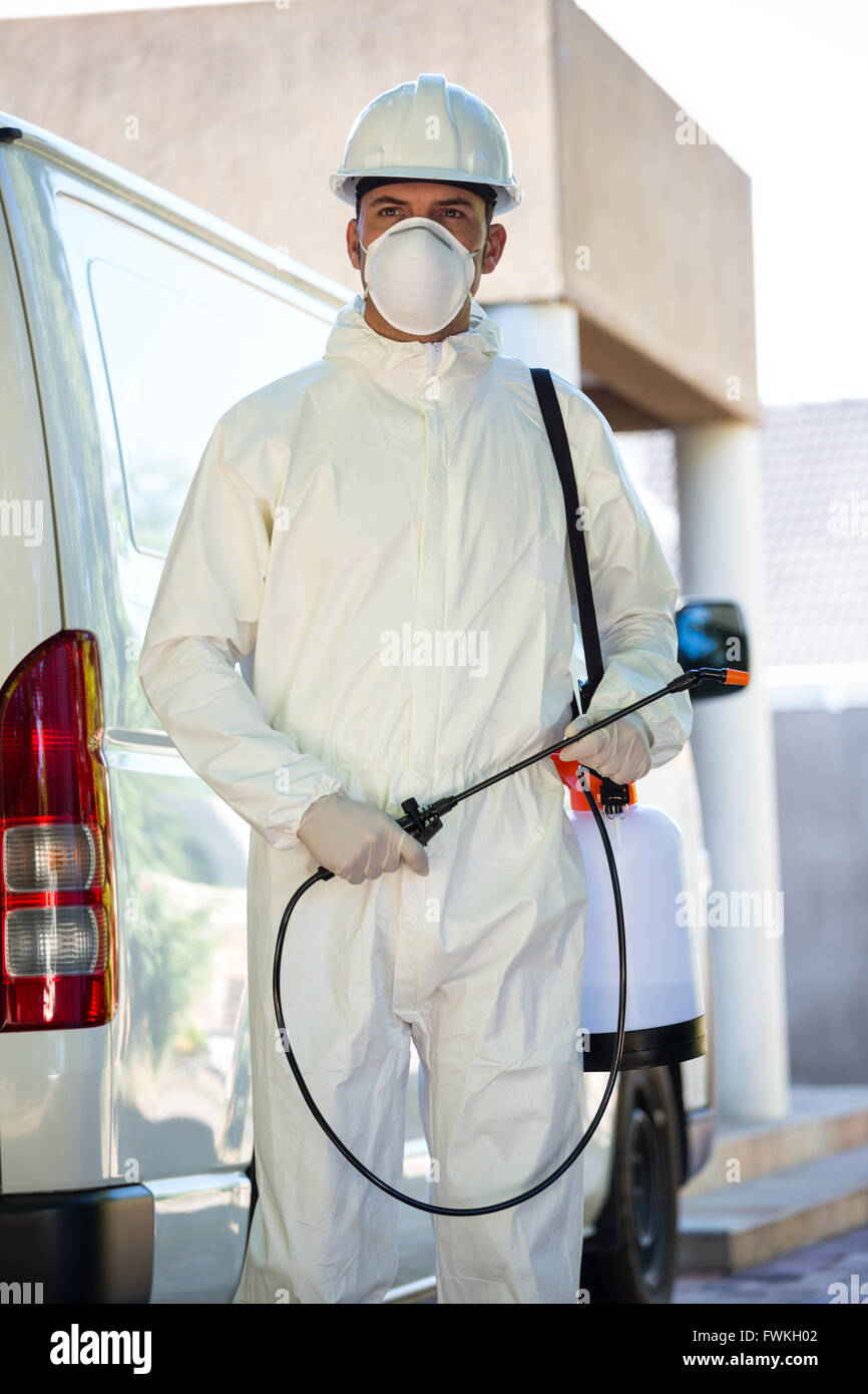 Portrait of pest control man standing next to a van Stock Photo - Alamy