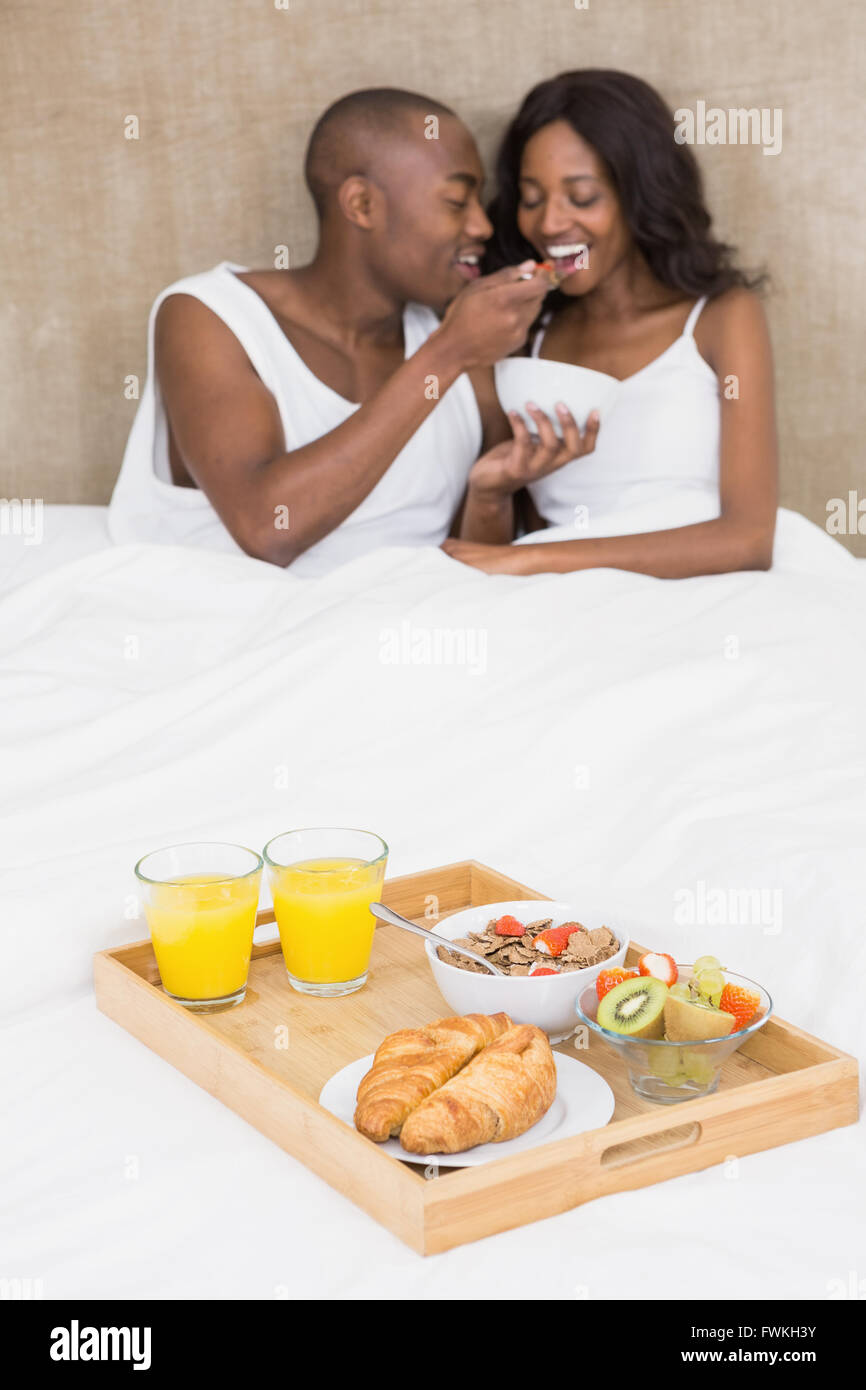 Young couple having breakfast Stock Photo - Alamy