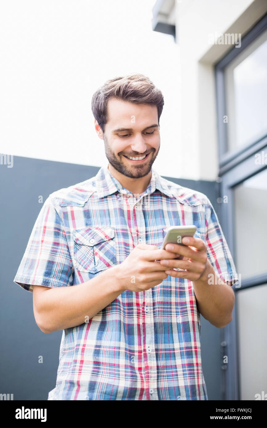 Man text messaging on mobile phone Stock Photo - Alamy